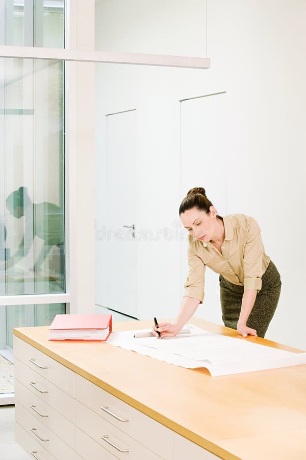 Female architect drawing stock image. Image of blueprint - 62558147