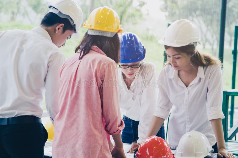 Female Architect and Engineer Working Together at Construction Area ...