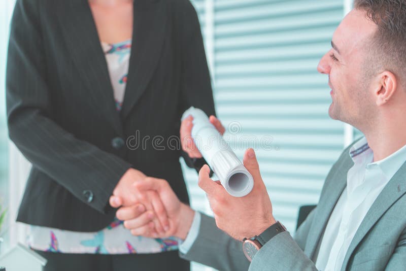 Female Architect Giving Her Boss the Real Estate Building Plan Stock ...