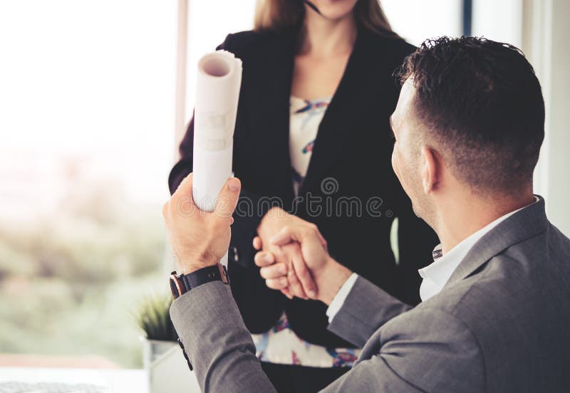 Female Architect Giving Her Boss the Real Estate Building Plan Stock ...
