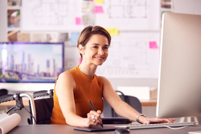 Female Architect in Office Working on Desktop Computer Using Graphics ...