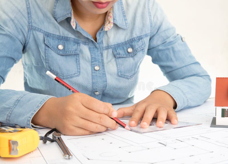 Female Architect is Revising Drawings Stock Image - Image of occupation ...