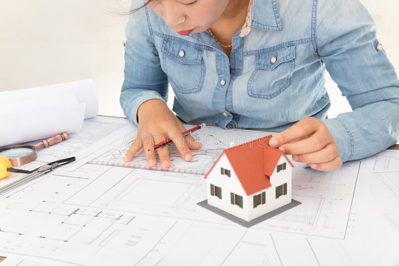 Female Architect is Revising Drawings Stock Image - Image of planning ...