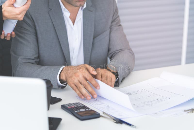 Female Architect Showing Her Boss the Real Estate Building Pl Stock ...