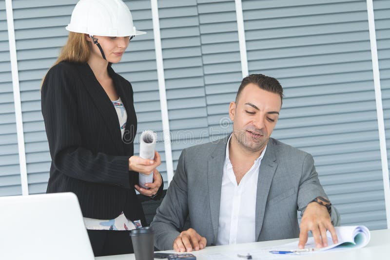 Female Architect Showing Her Boss the Real Estate Building Pl Stock ...