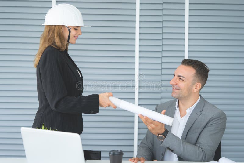 Female Architect Showing Her Boss the Real Estate Building Pl Stock ...