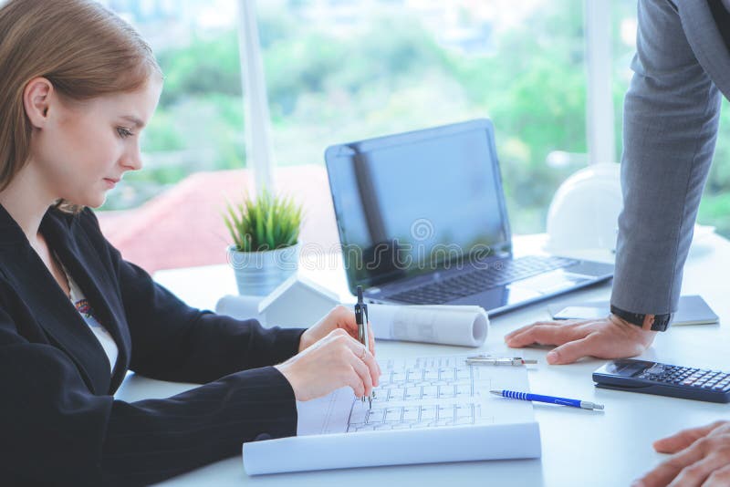Female Architect Showing Her Boss the Real Estate Building Pl Stock ...
