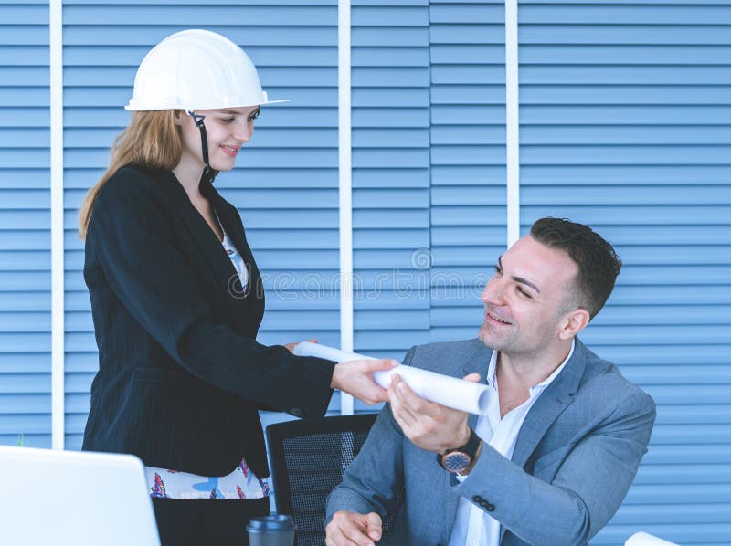 Female Architect Showing Her Boss the Real Estate Building Pl Stock ...