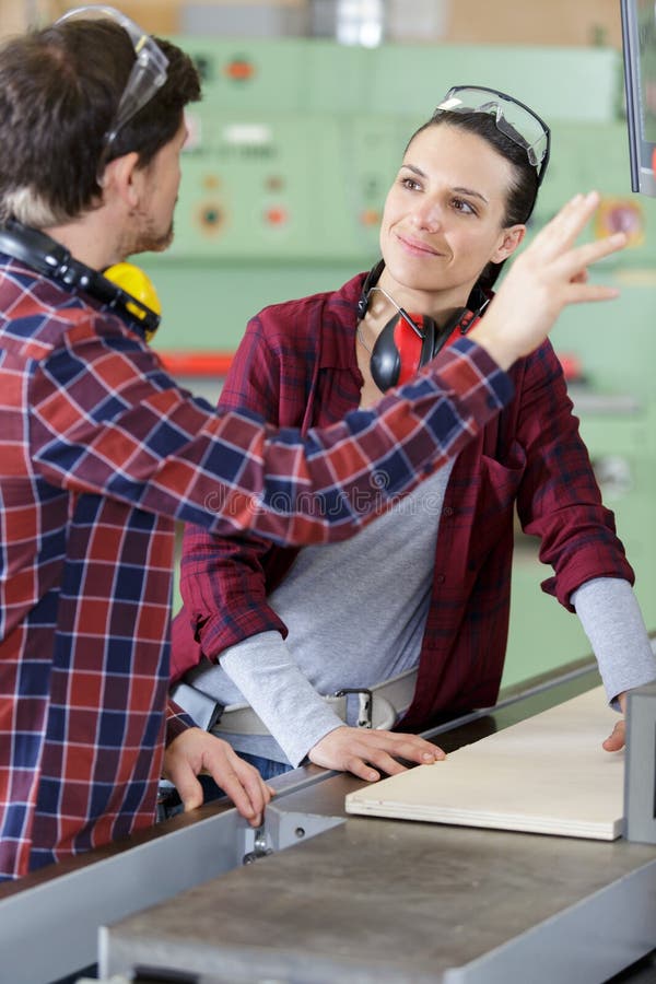 Female Architect Talking with Joiner Talking in Workshop Stock Image ...