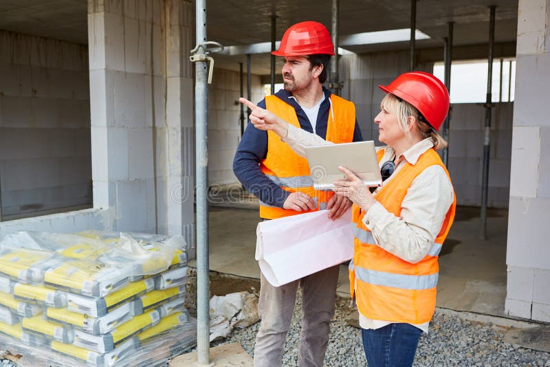 Female Architect Using Tablet Computer on a Construction Site Stock ...