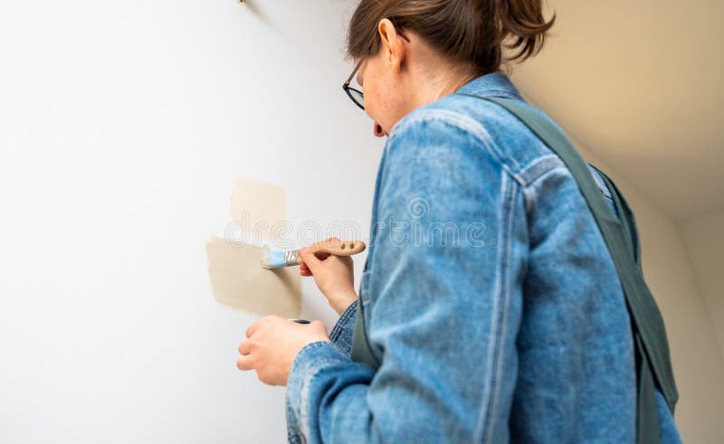 Female Architect Woman Testing Light Paint from Sample Pot Stock Image ...