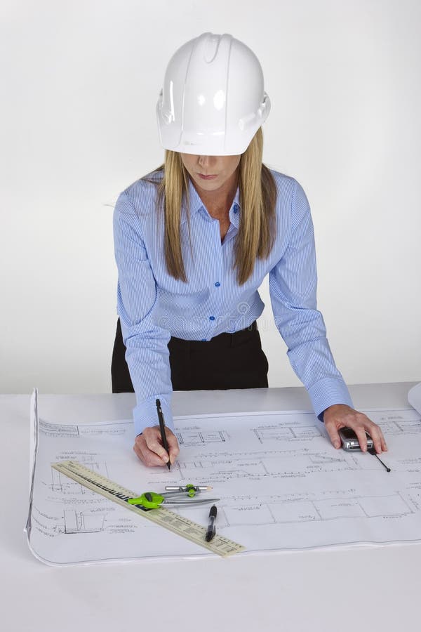 Female Architect Working on Blue Prints Stock Image - Image of looking ...