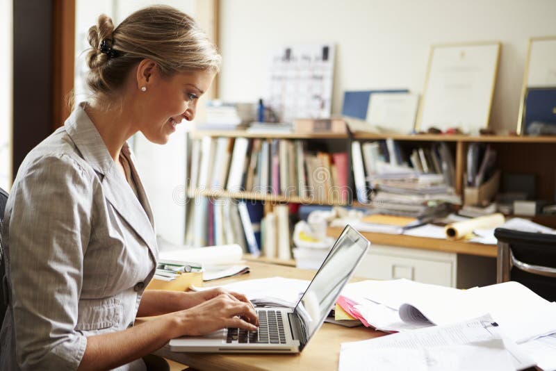 Female Architect Working at Desk on Computer Stock Image - Image of ...