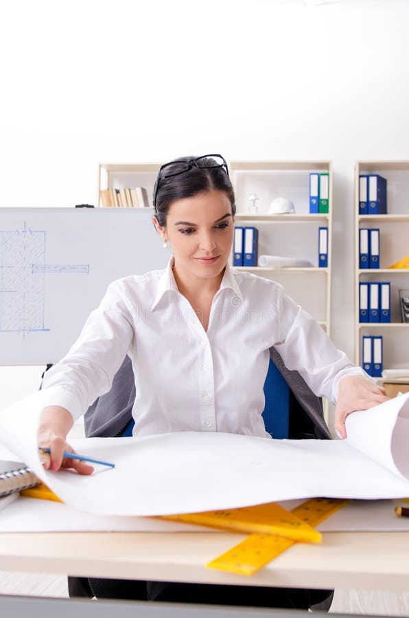 The Female Architect Working in the Office Stock Photo - Image of draft ...