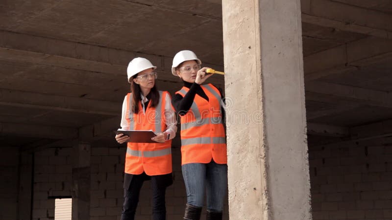Two Architects Measuring Building Scale on Blueprint Stock Footage ...