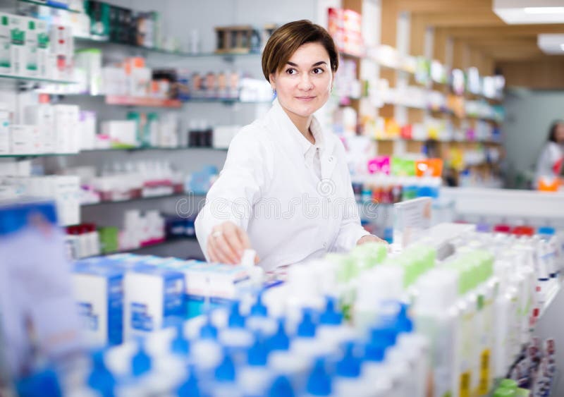 Female Arranging Assortment of Products Stock Photo - Image of ...