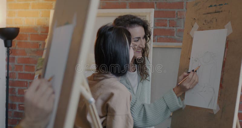 Female Artist Teaching Girl Student Drawing Together Talking during ...