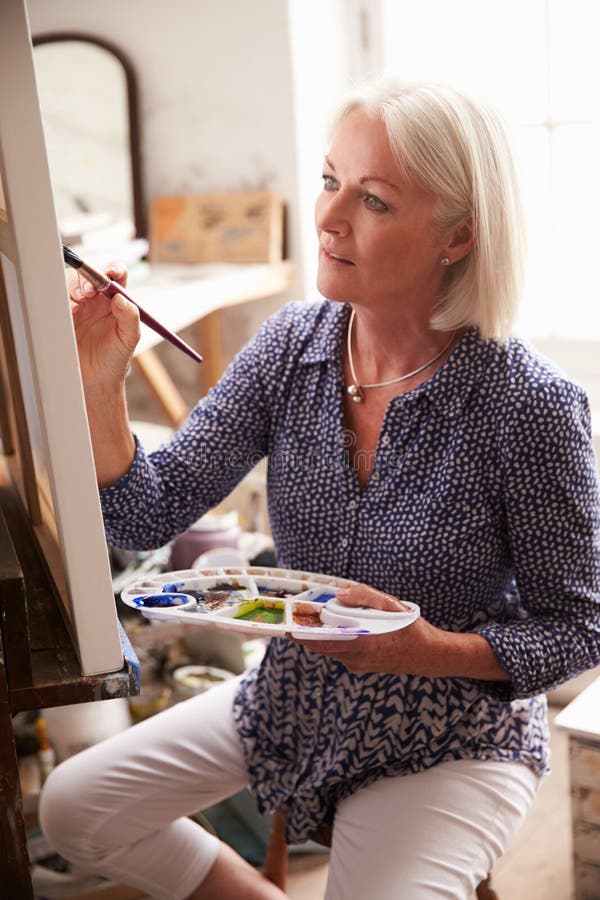 Female Artist Working on Painting in Bright Daylight Studio Stock Photo ...