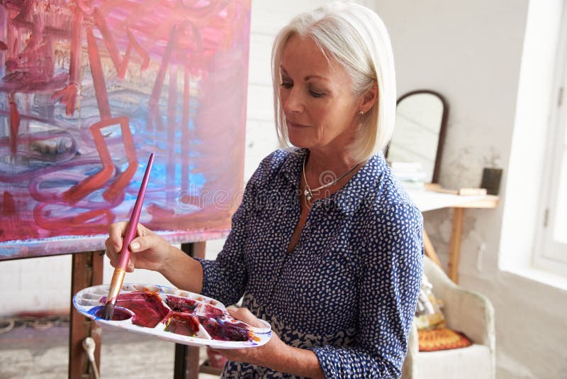 Female Artist Working on Painting in Studio Stock Photo - Image of ...