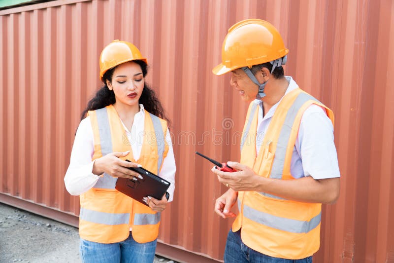 Female Asian Engineer and Foreman Engineer Loading Containers from ...