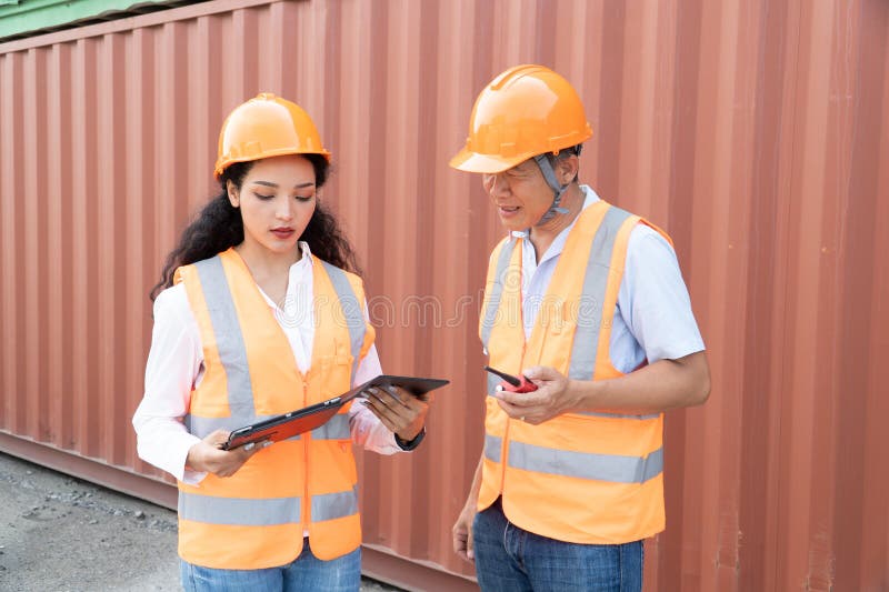 Female Asian Engineer and Foreman Engineer Loading Containers from ...