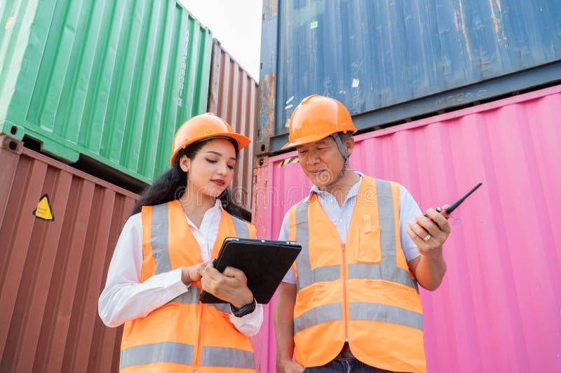 Female Asian Engineer and Foreman Engineer Loading Containers from ...