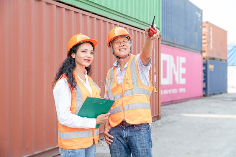 Female Asian Engineer and Foreman Engineer Loading Containers from ...