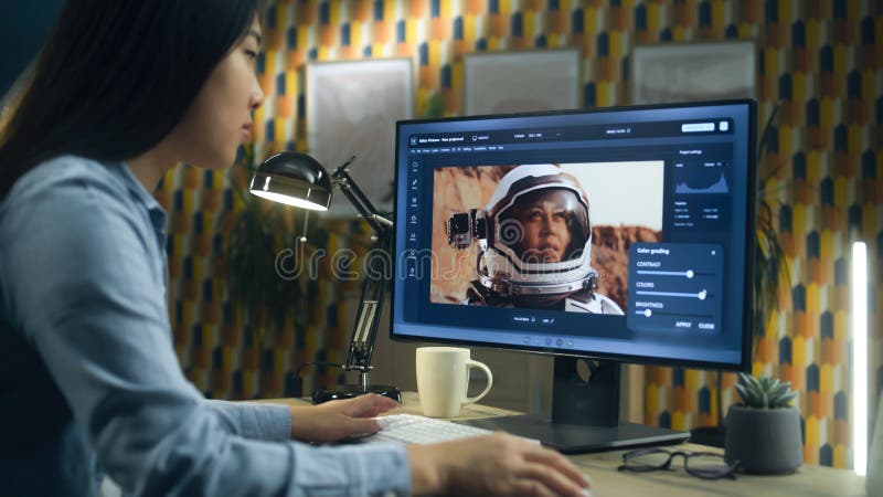 Asian woman editing photo stock image. Image of astronaut - 257190781