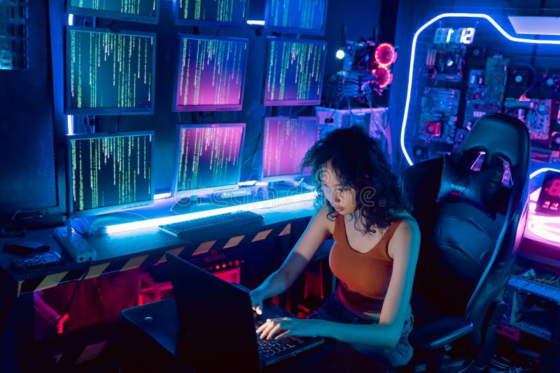 Female Asian Hacker in Hideout Place with Dark Environment and Multiple ...