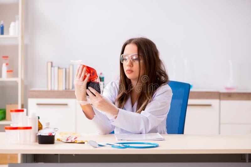 The Female Assistant with Bag of Blood in the Lab Stock Image - Image ...
