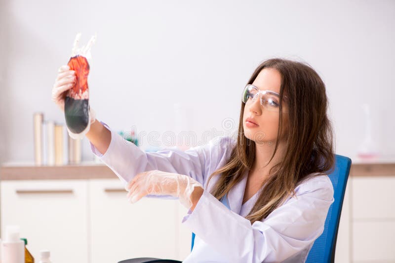 The Female Assistant with Bag of Blood in the Lab Stock Image - Image ...