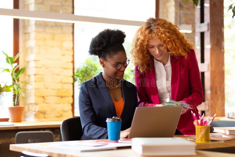 Female Assistant Helping Interior Designer with Project Stock Image ...