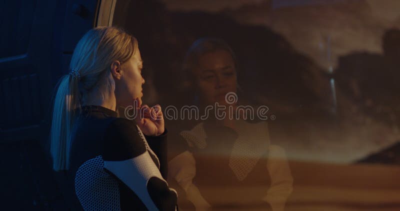 Female Astronaut Looking Out of Mars Base Window Stock Video - Video of ...