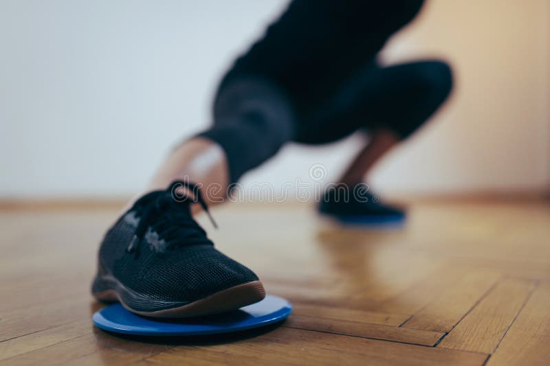 Exercising with Gliding Discs Stock Image - Image of female, sliding ...