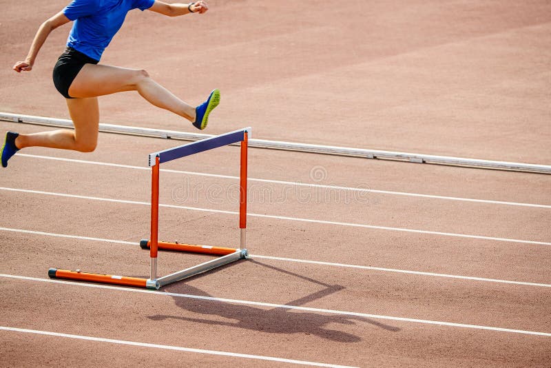 Female athlete hurdling stock photo. Image of hurdle - 268420590