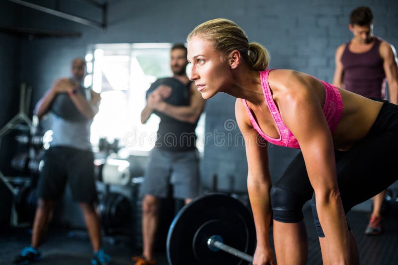 Female Athlete Lifting Barbell Stock Image - Image of black, exercising ...
