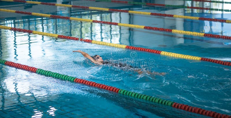 Female Athlete Performing the Backstroke Swim Technique Stock Image ...