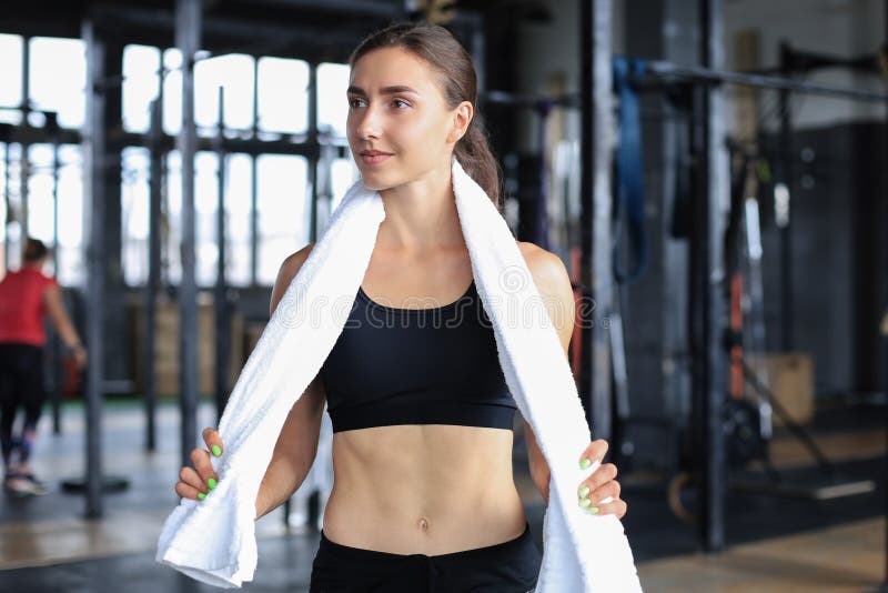 Female Athlete Preparing for a Workout in a Gym Stock Photo - Image of ...