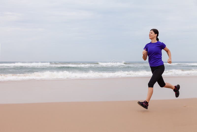 Female Athlete Running at the Beach Stock Image - Image of outdoors ...