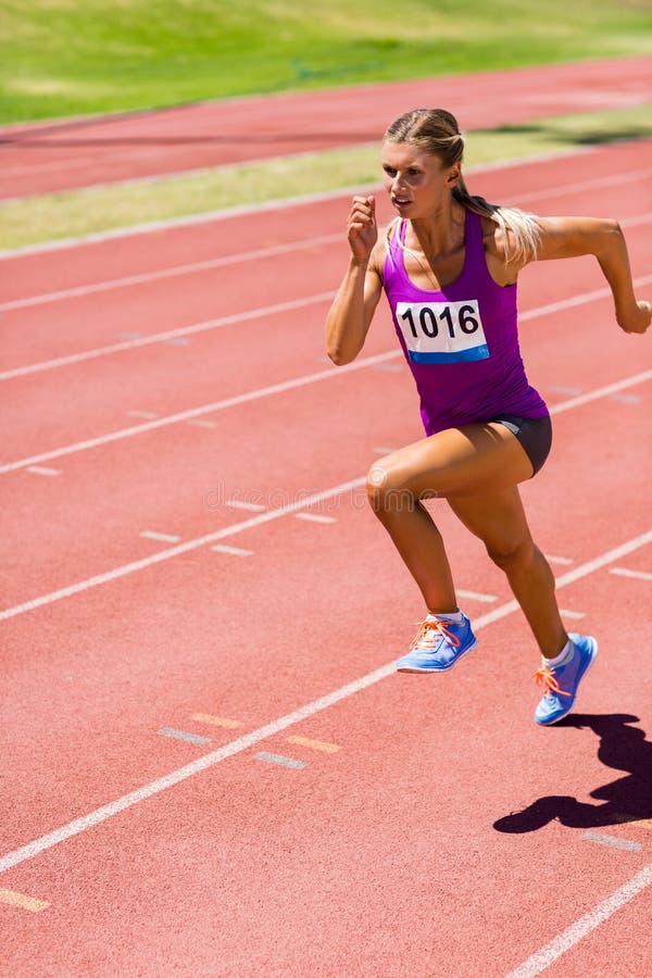 Female Athlete Running on the Racing Track Stock Image - Image of ...