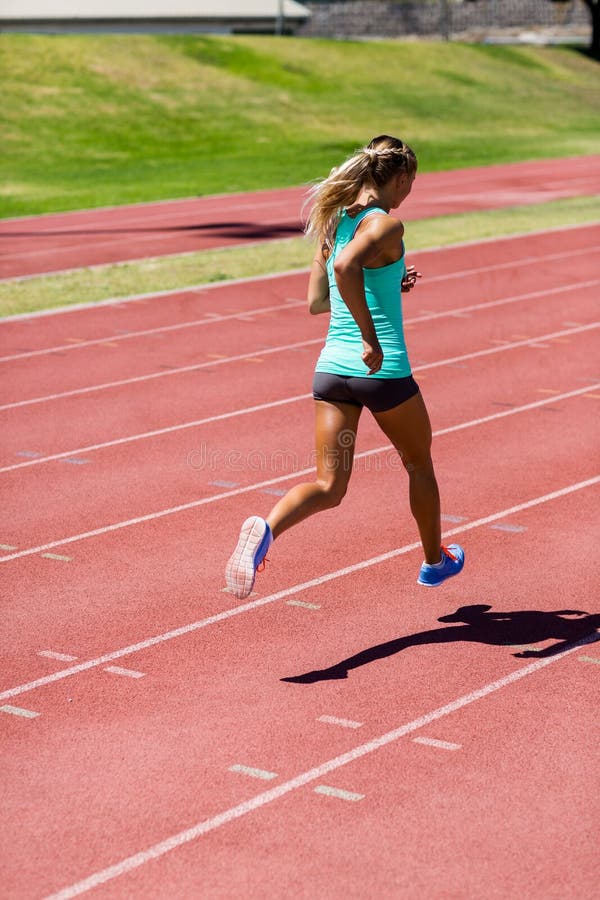 Female Athlete Running on the Racing Track Stock Photo - Image of ...