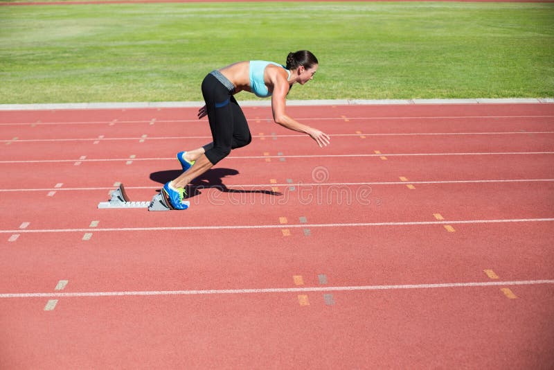 Female Athlete Running from Starting Blocks Stock Image - Image of ...