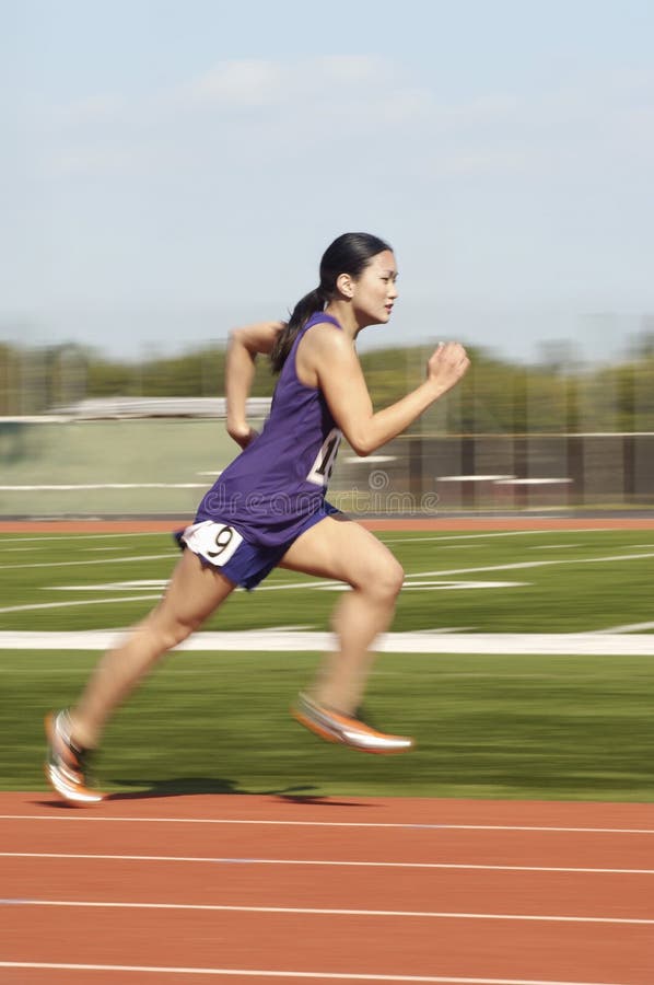 Female Athlete Running on Track Stock Photo - Image of outdoors ...