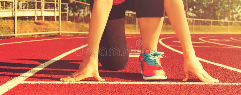 Female Athlete on the Starting Line of a Stadium Track Stock Photo ...