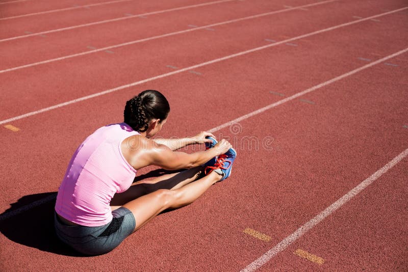 Female Athlete Stretching Her Hamstring Stock Photo - Image of running ...