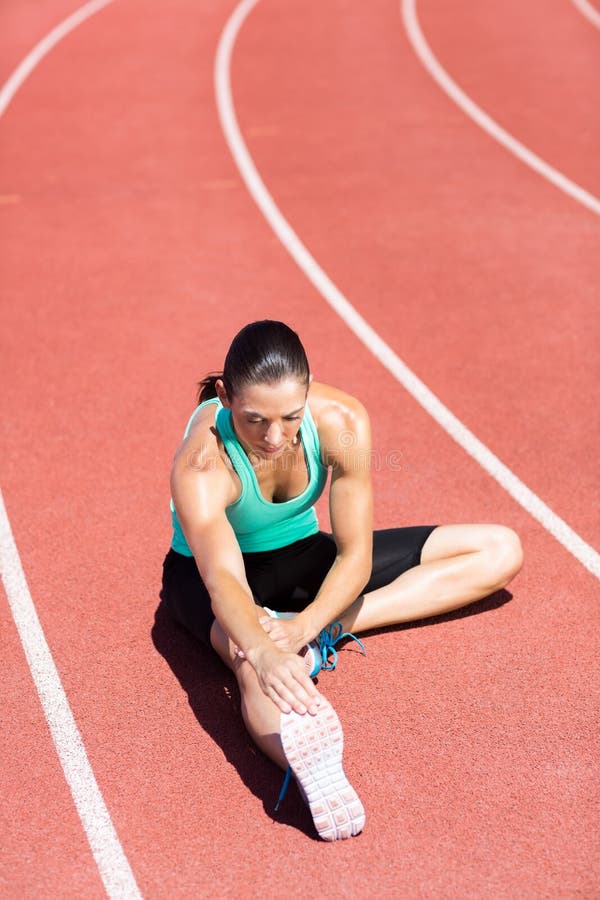 Female Athlete Stretching Her Hamstring Stock Photo - Image of olympic ...