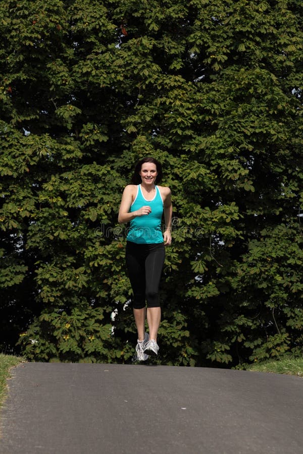 Female Athlete Training by Running through Trees Stock Image - Image of ...