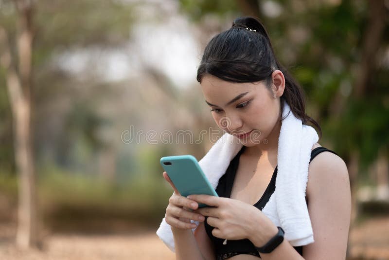 Female Athlete Use Smartphone Waiting for Training Stock Image - Image ...