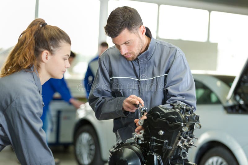 Female Auto Mechanic Learning To Fix Engine Stock Photo - Image of girl ...