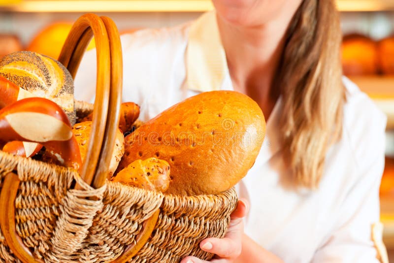 Female Baker in Bakery Selling Bread by Basket Stock Image - Image of ...